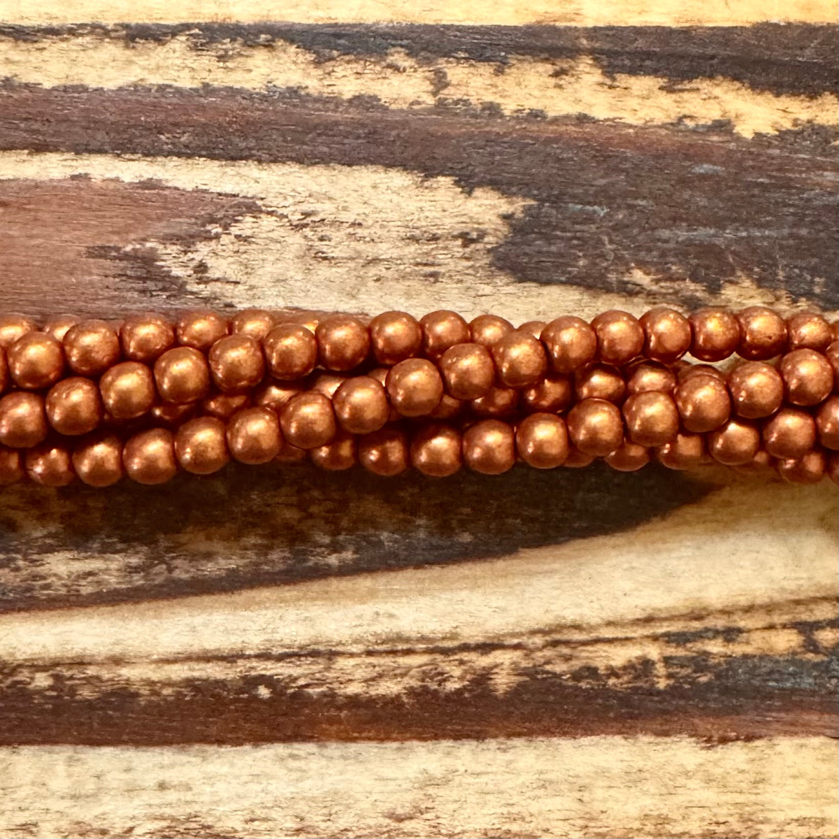 5-04-06B06 - Czech Round Pressed Beads, Saturated Metallic Russet Oran ...